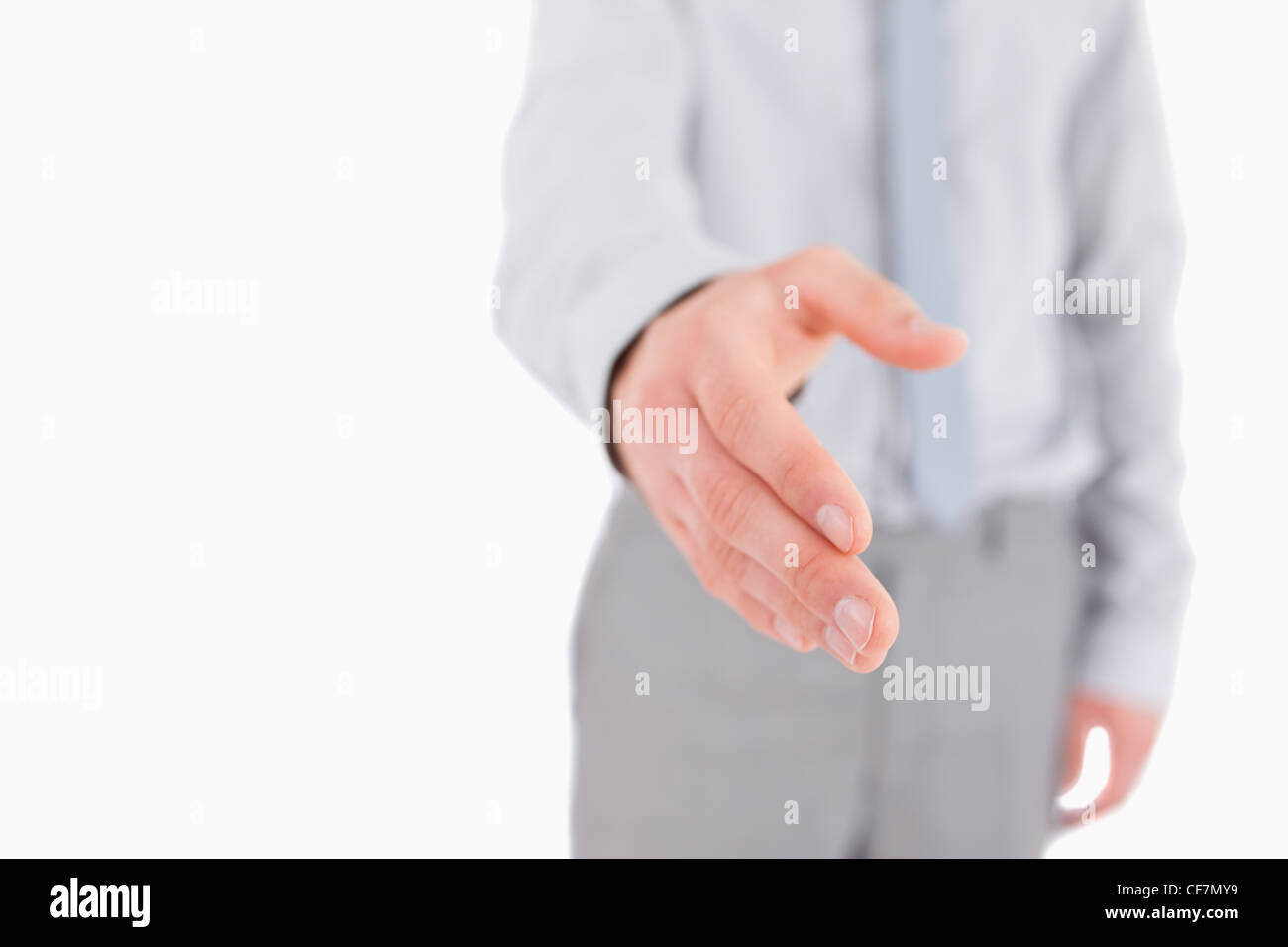 Businessman giving his hand Stock Photo - Alamy
