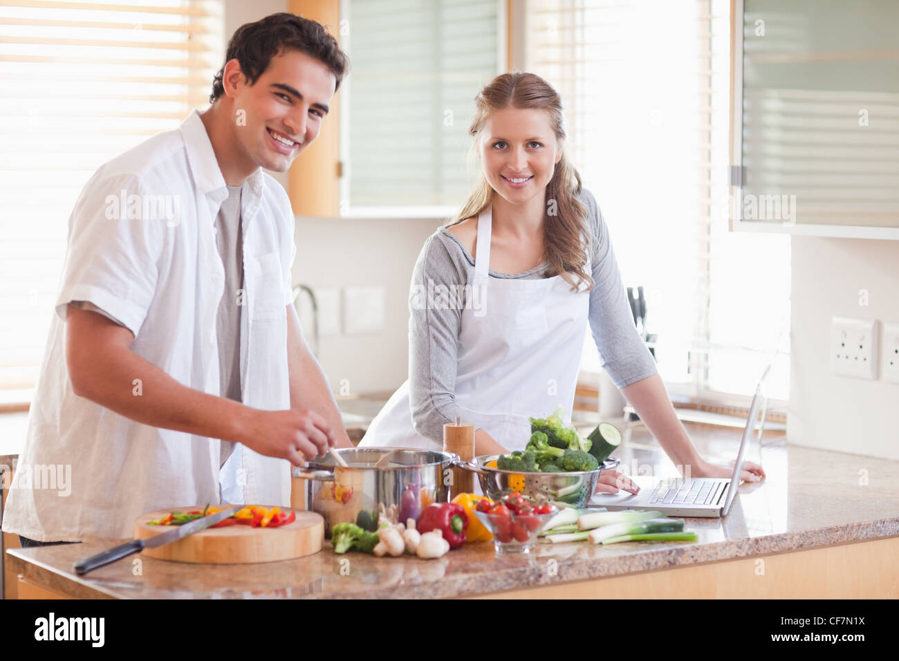 Young male chef using notebook hi-res stock photography and images - Alamy