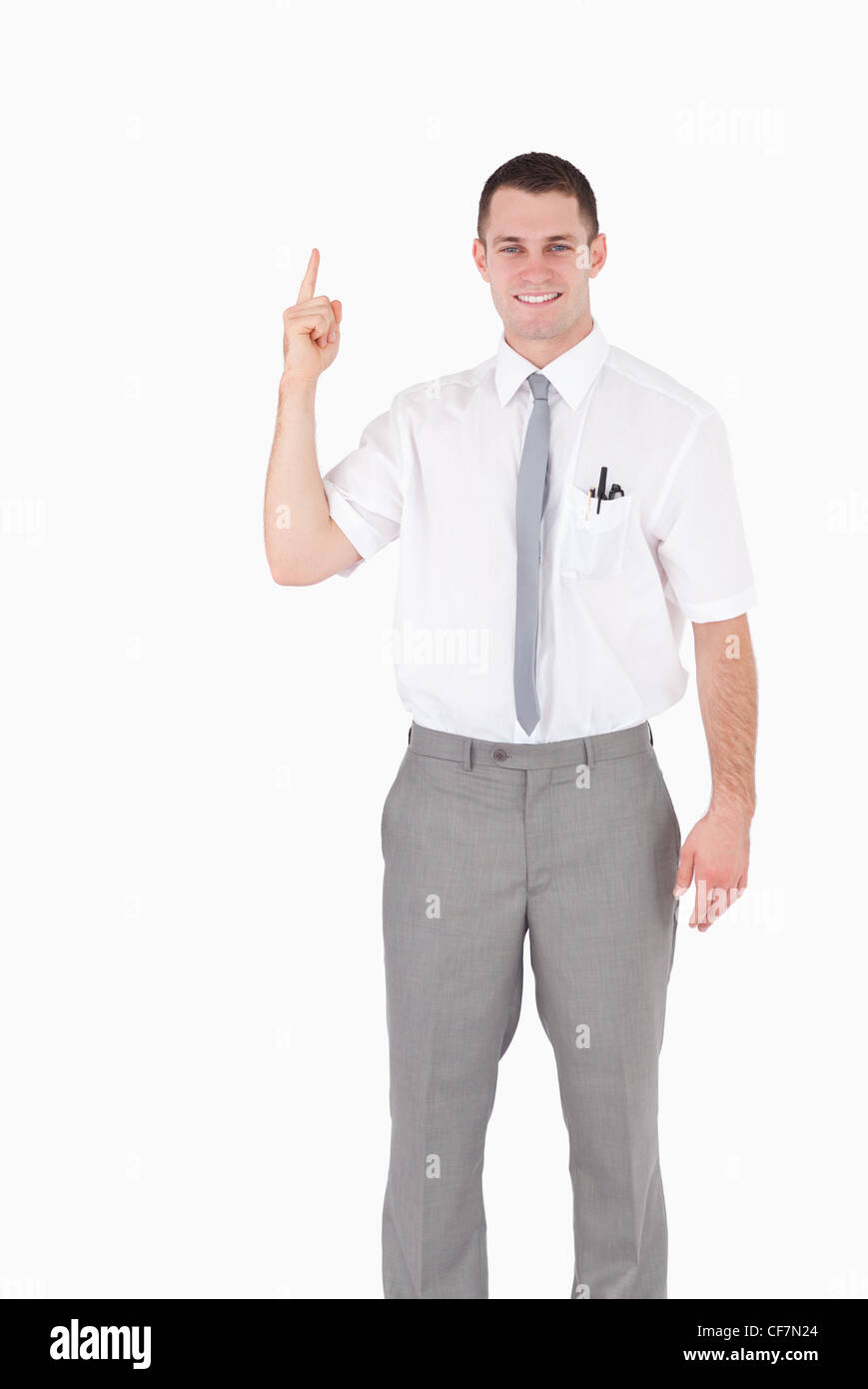 Portrait of an office worker pointing at something Stock Photo - Alamy