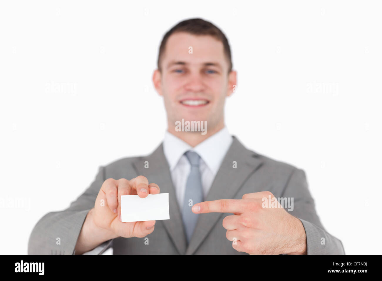 Smiling businessman pointing at a blank business card Stock Photo - Alamy Smiling businessman pointing at a blank business card Stock Photo - Alamy