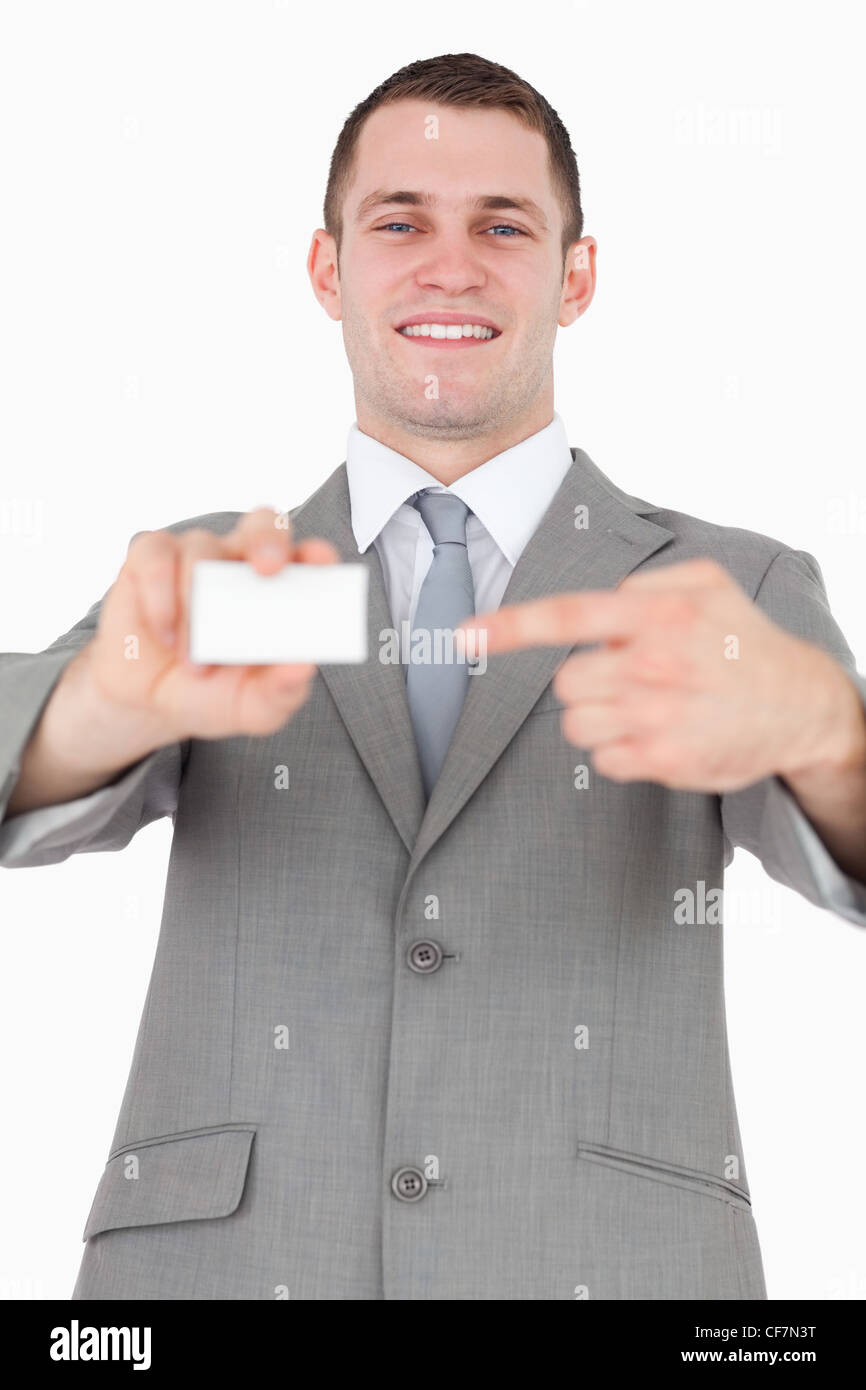 Portrait of a businessman pointing at a blank business card Stock Photo ...