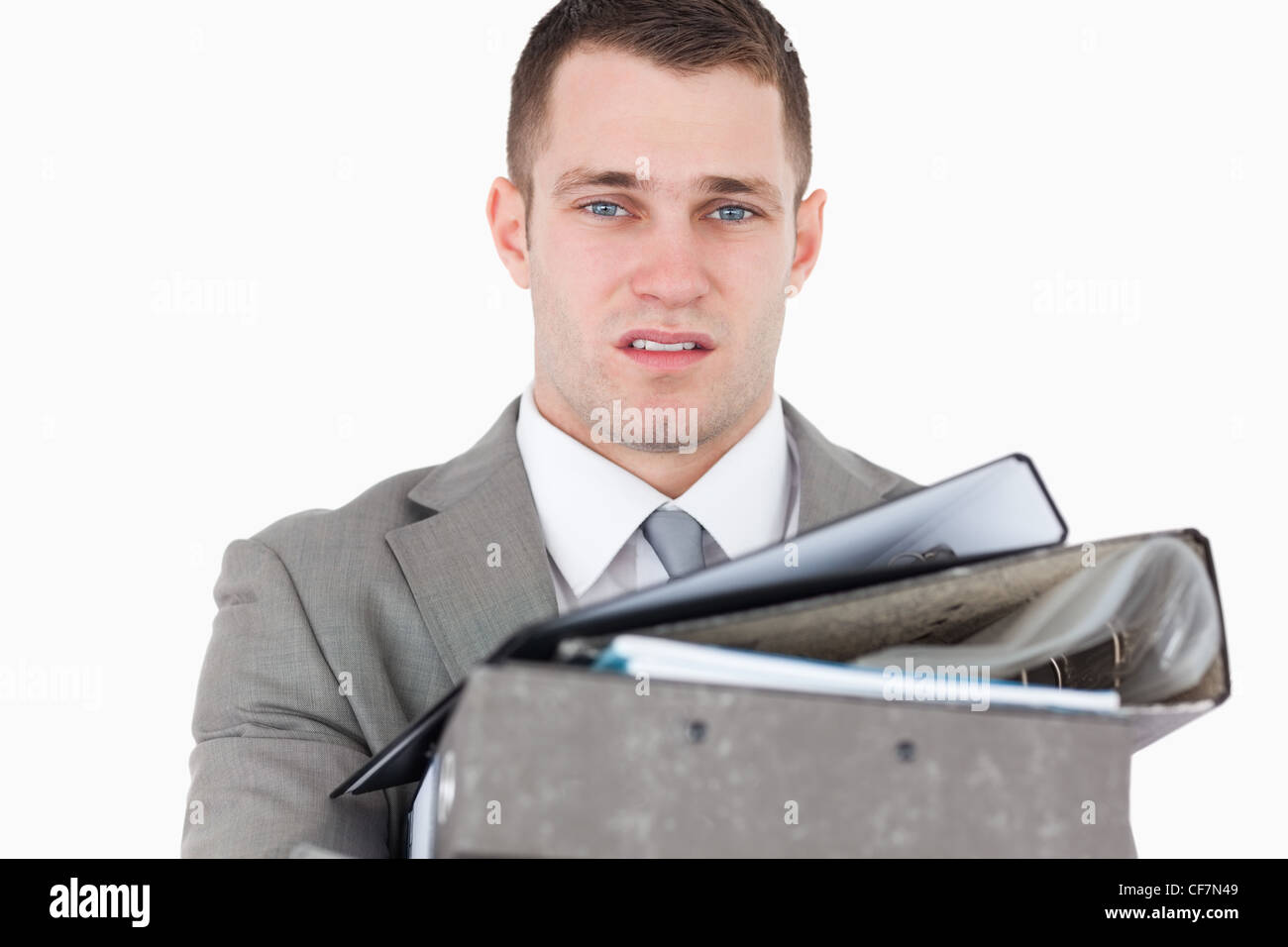 Overwhelmed young businessman Stock Photo - Alamy