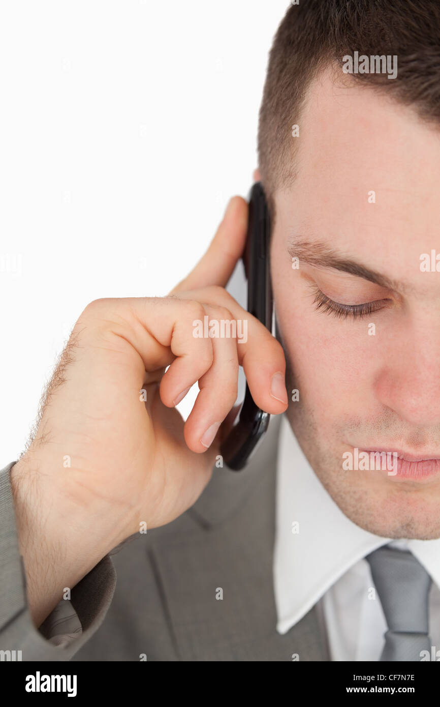 Close up of a tired businessman making a phone call Stock Photo - Alamy