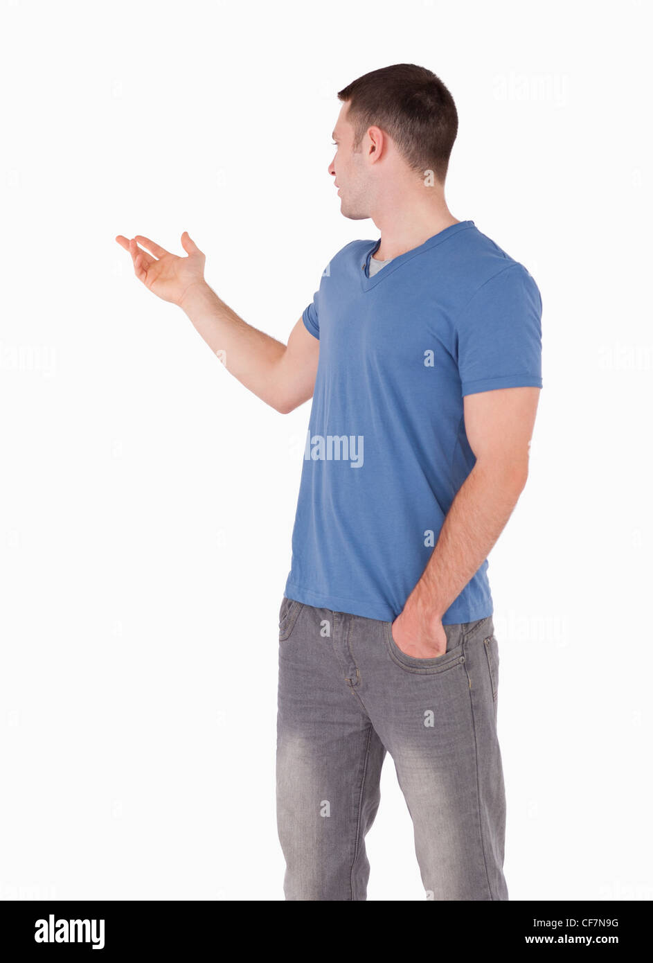 Portrait of a man showing something Stock Photo - Alamy