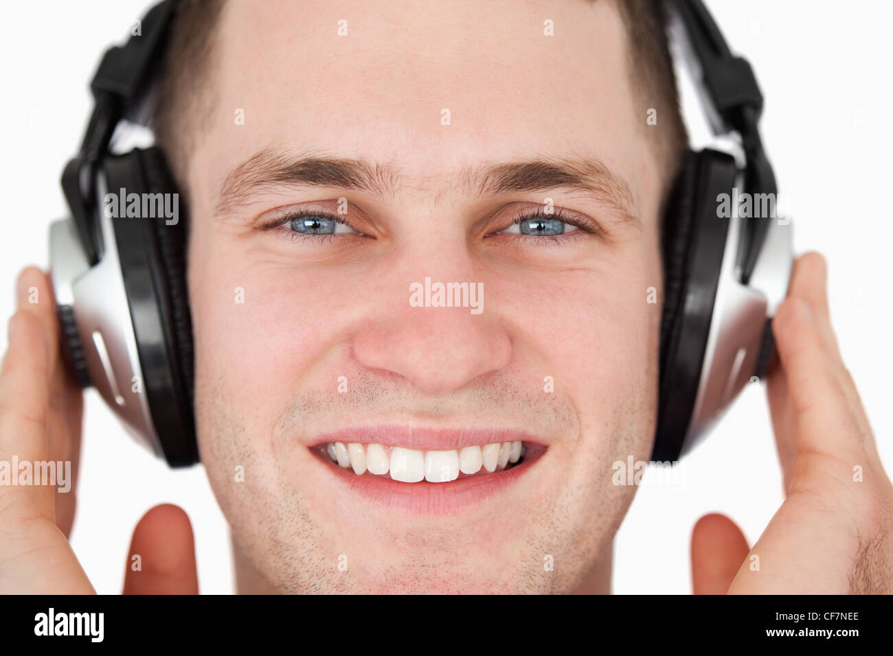 Close up of a happy man listening to music Stock Photo - Alamy