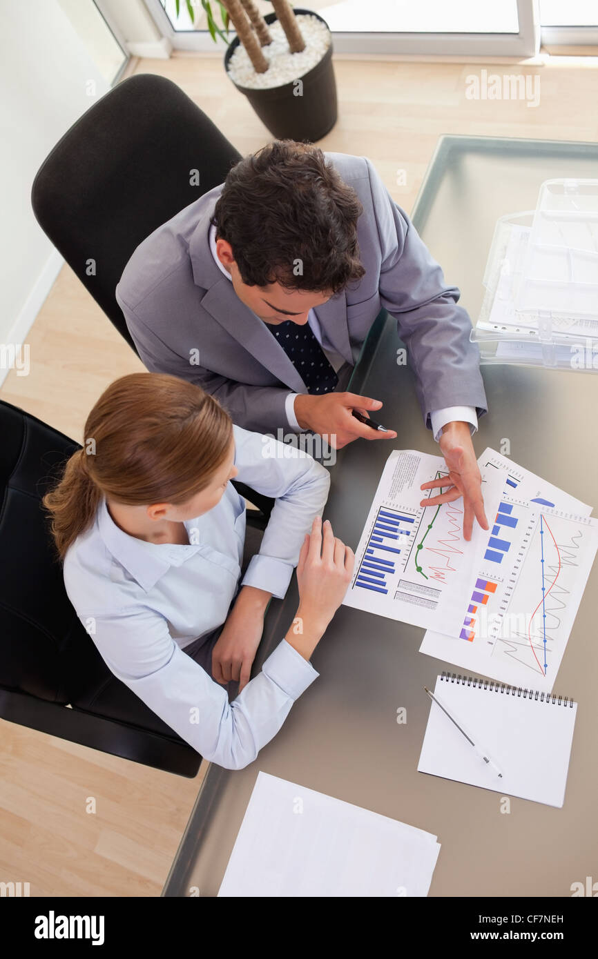 Businesspeople analyzing financial statistics hi-res stock photography ...