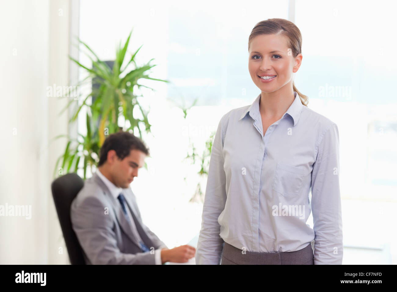 Tradeswoman with colleague behind her Stock Photo - Alamy