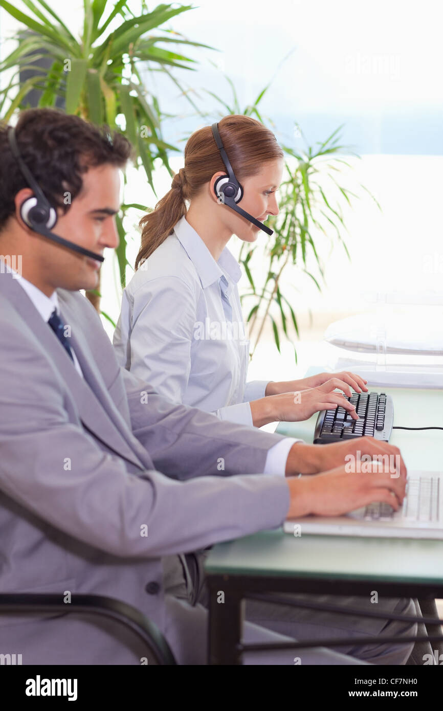 Hotline employees at work Stock Photo - Alamy
