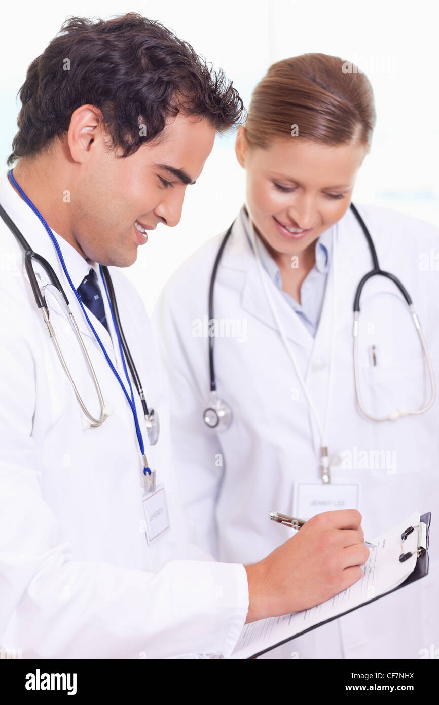 Doctor taking patients record hi-res stock photography and images - Alamy