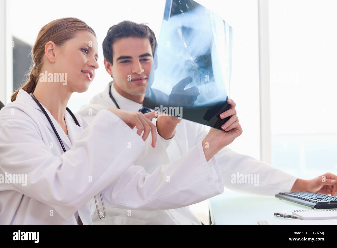 Man at doctors office talking hi-res stock photography and images - Alamy