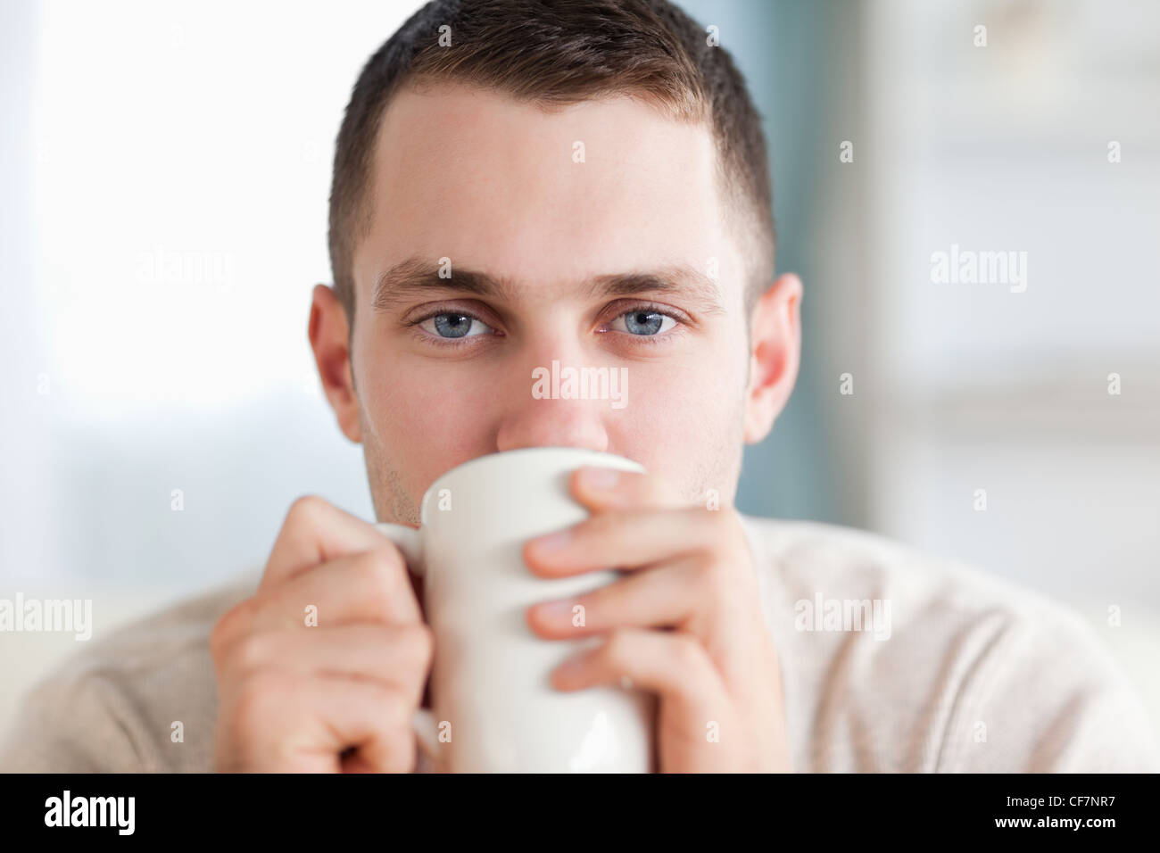 Handsome man having a tea Stock Photo - Alamy