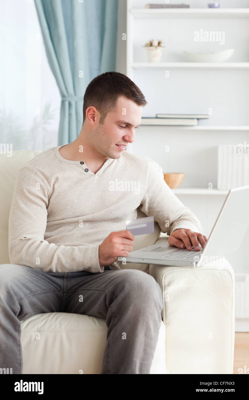 Portrait of a young man shopping online Stock Photo - Alamy