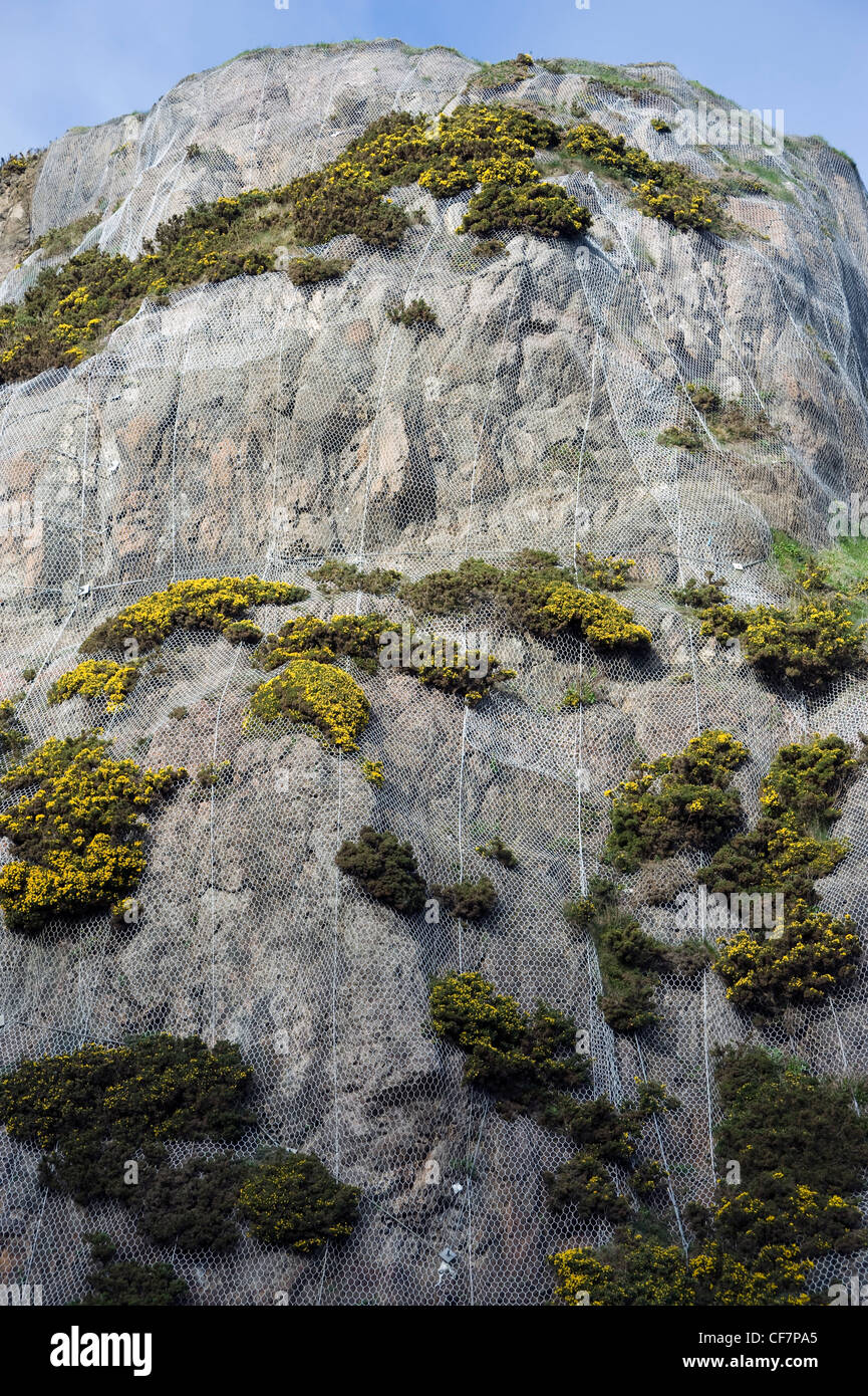 Cliff covered in steel mesh to prevent rockfall Stock Photo - Alamy