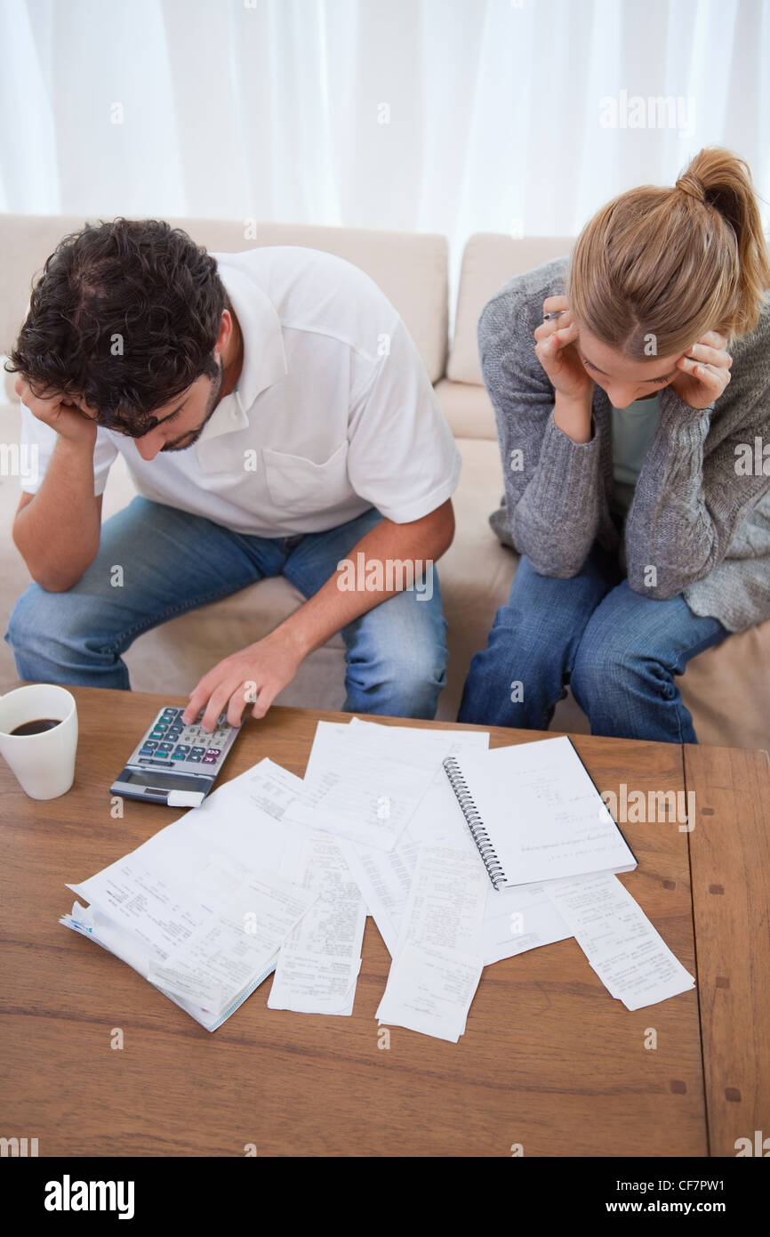 Portrait of a young couple doing their accounting Stock Photo - Alamy