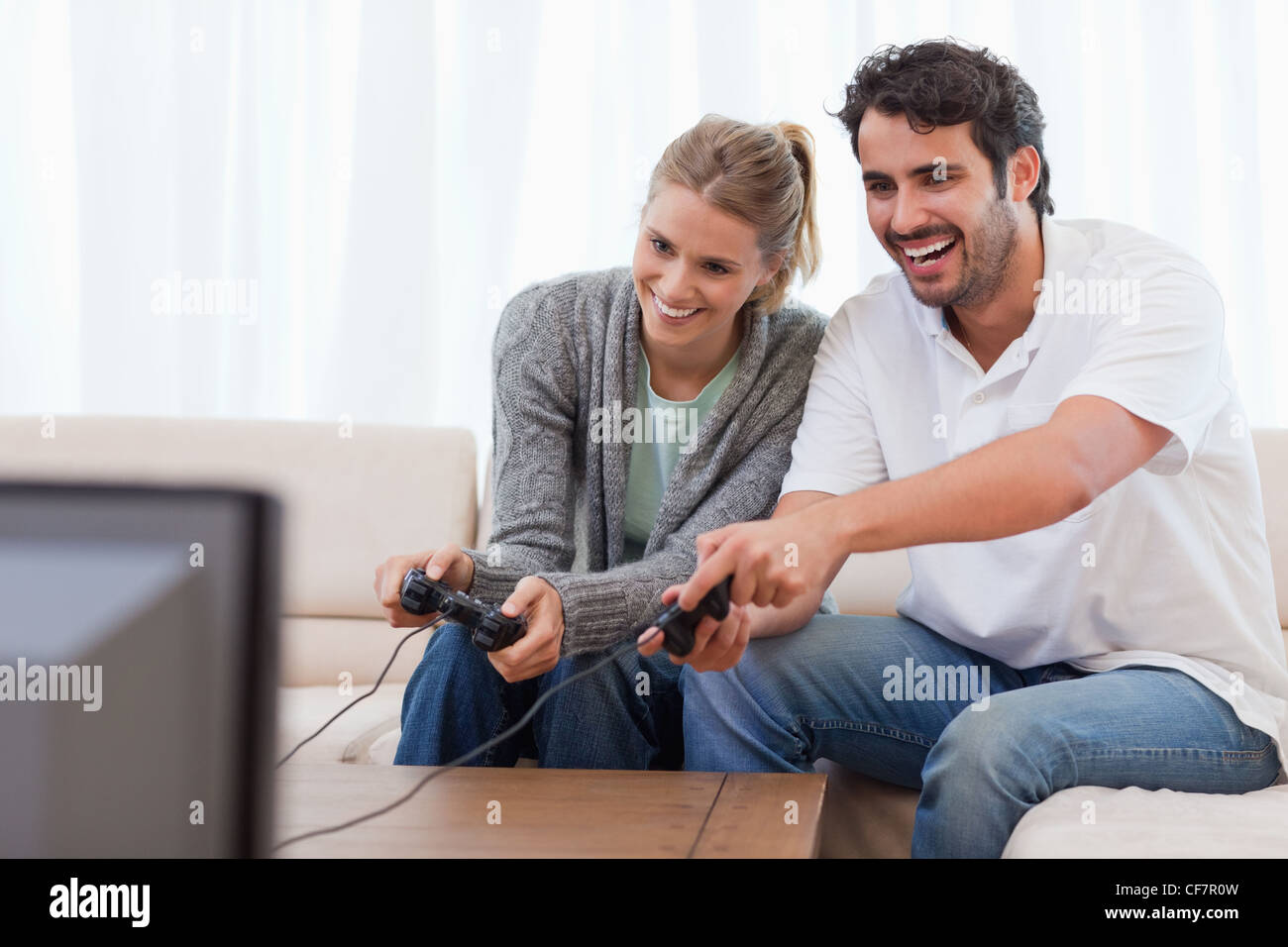 Couple playing video games Stock Photo - Alamy