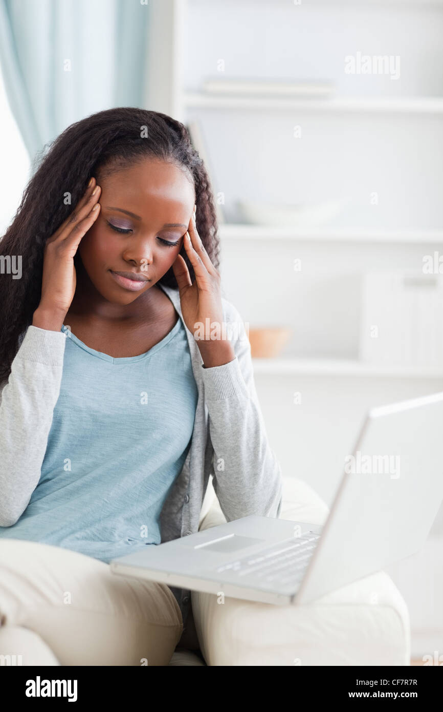 Close up of laptop gives woman a headache Stock Photo - Alamy