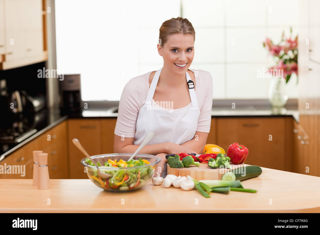 Young woman cooking Stock Photo - Alamy