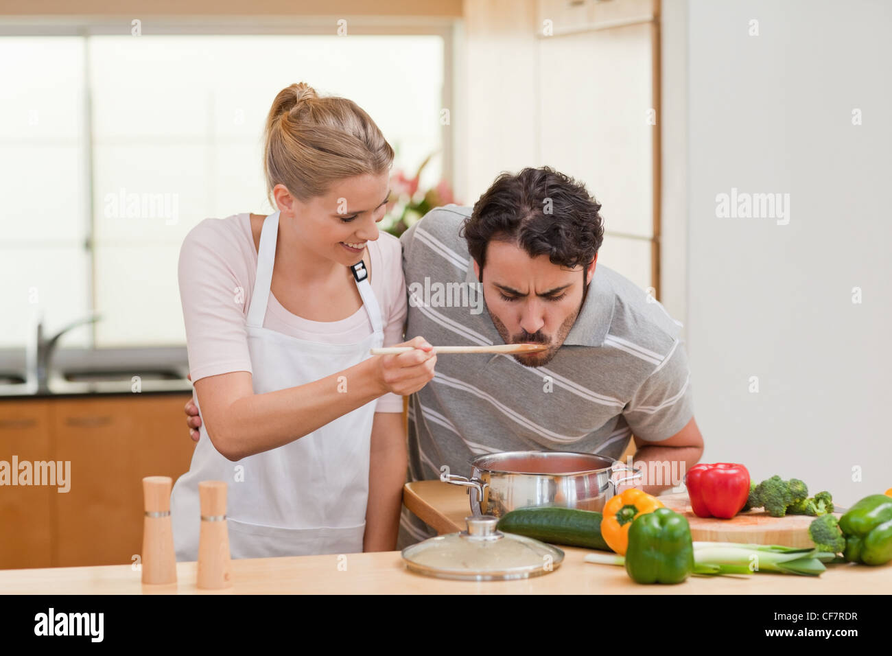Couple preparing a sauce Stock Photo - Alamy