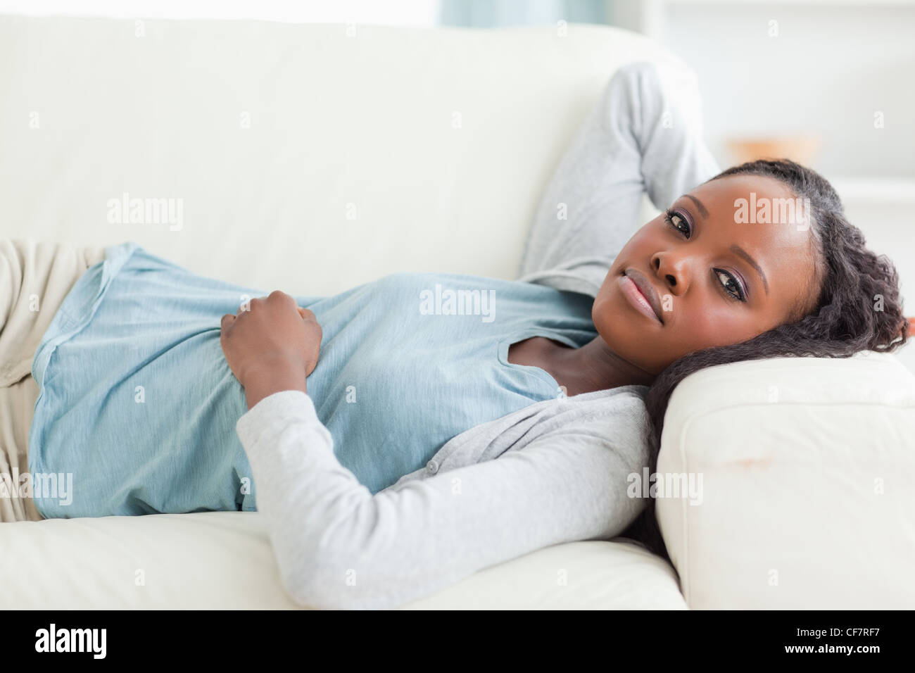 Woman taking a rest on the couch Stock Photo - Alamy