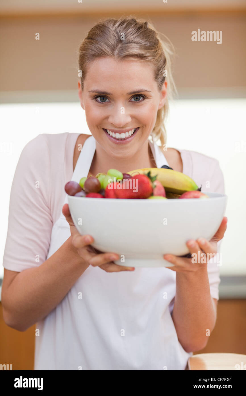 Portrait of a woman holding a fruit basket Stock Photo - Alamy