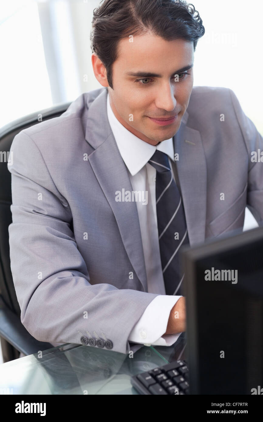Portrait of a young businessman working with a computer Stock Photo - Alamy