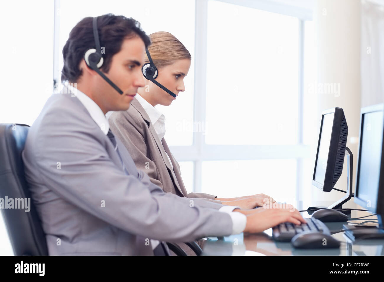 Young operators using a computer Stock Photo - Alamy