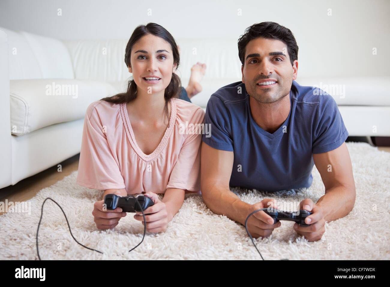 Young couple playing video games Stock Photo - Alamy