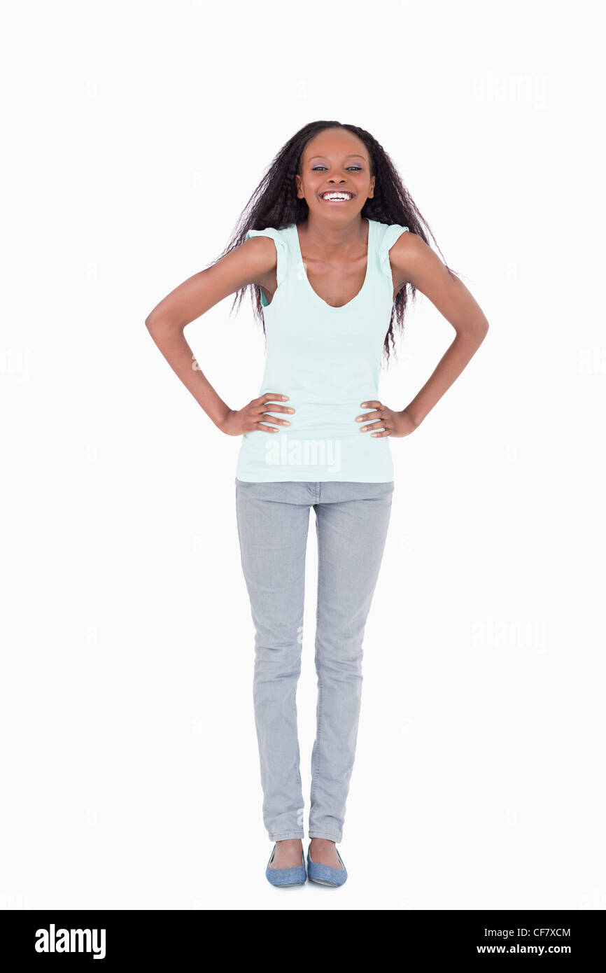 Woman with both arms akimbo on white background Stock Photo - Alamy