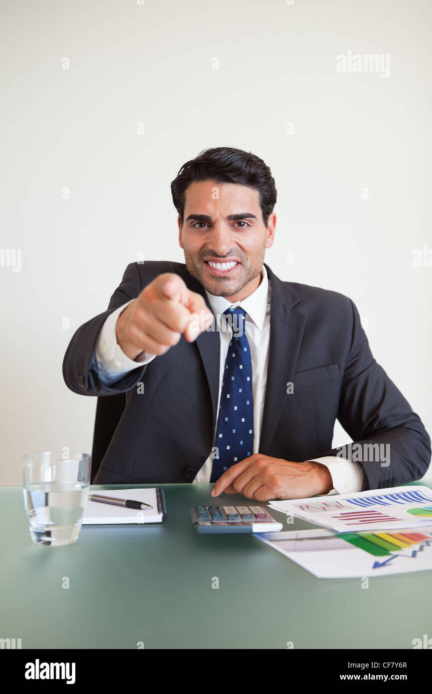 Portrait of a angry businessman pointing at the viewer Stock Photo - Alamy