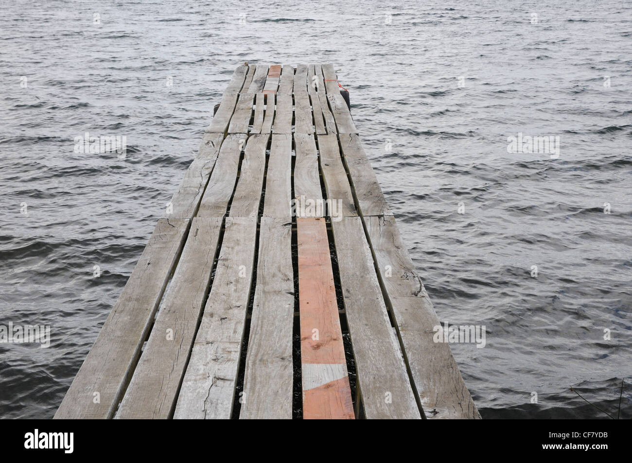 Wooden jetty, choppy water, Lake Llanquihue, Los Lagos region ...
