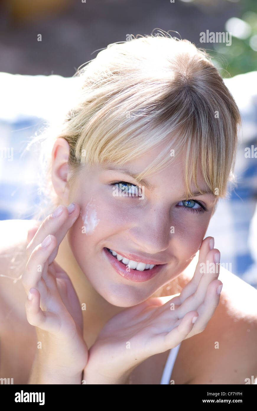 Applying face cream Stock Photo - Alamy