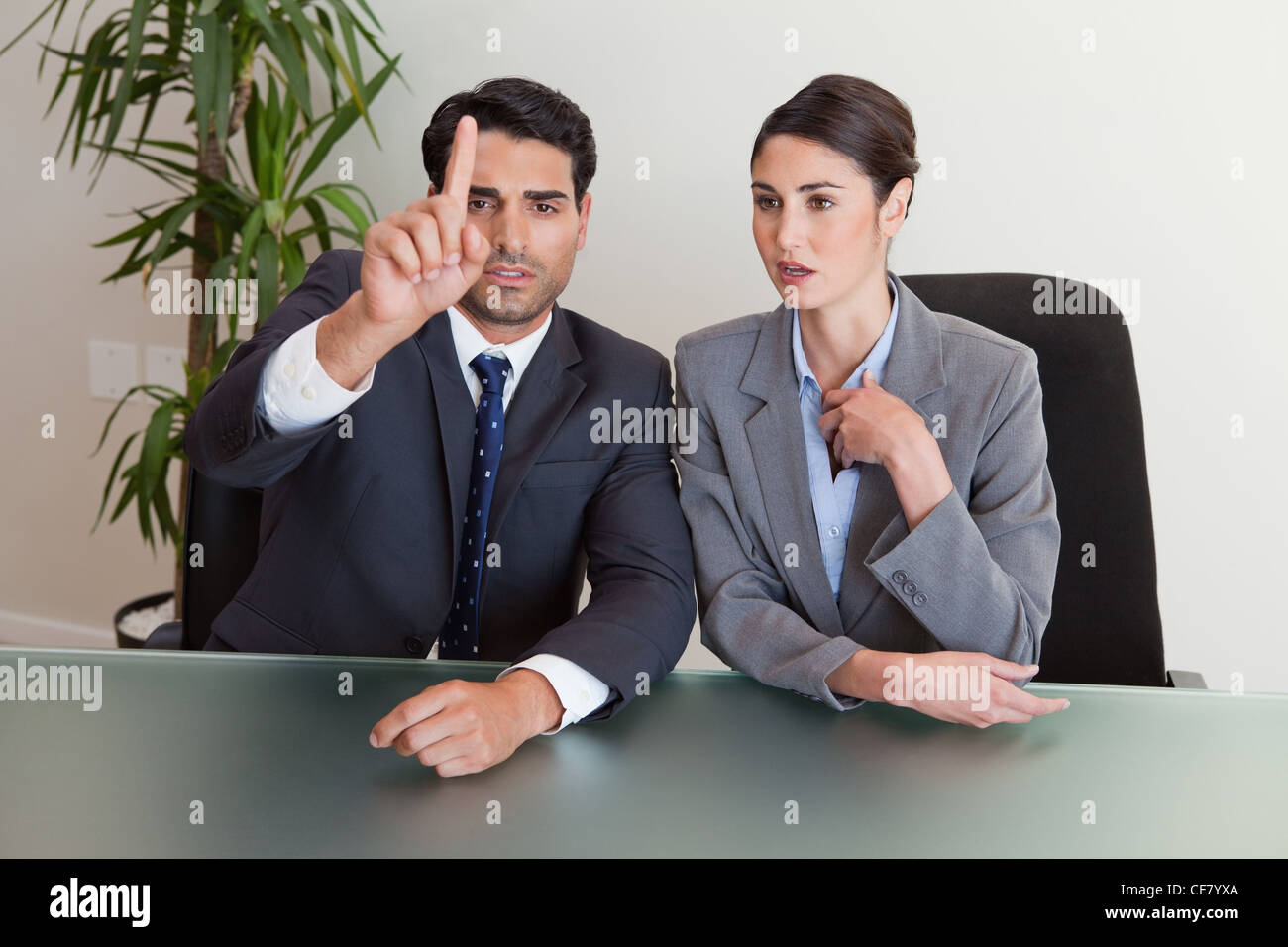 Young business people negotiating Stock Photo - Alamy