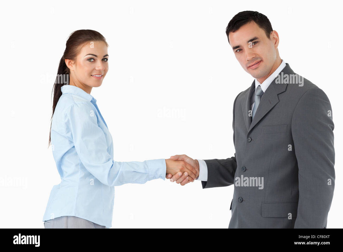 Young business partners shaking hands Stock Photo - Alamy