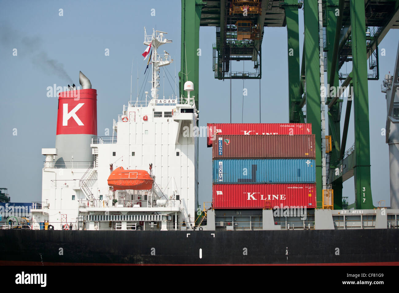 Container ships are seen moored at the Pasir Panjang terminal of the ...