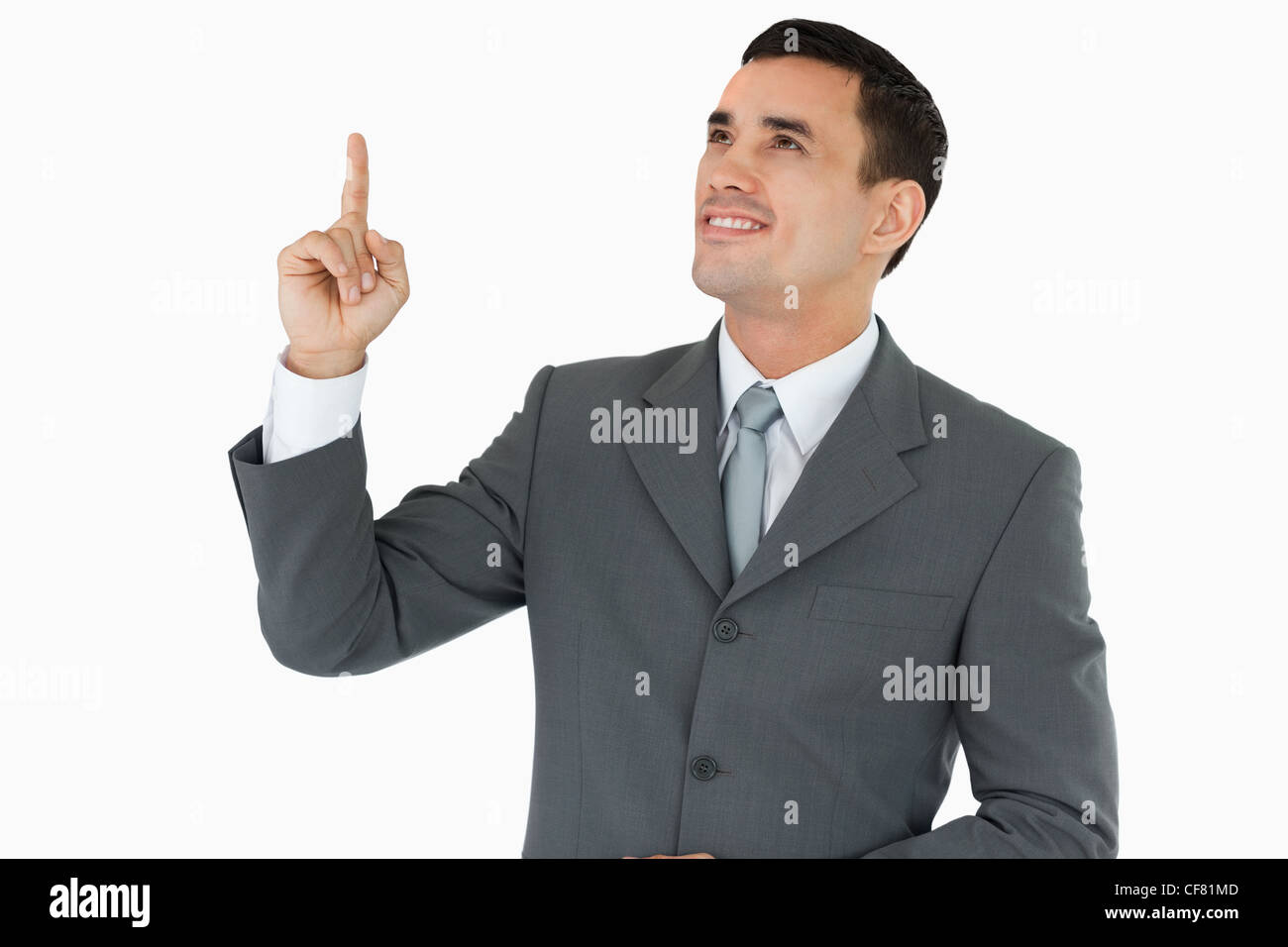Businessman looking and pointing upwards Stock Photo - Alamy