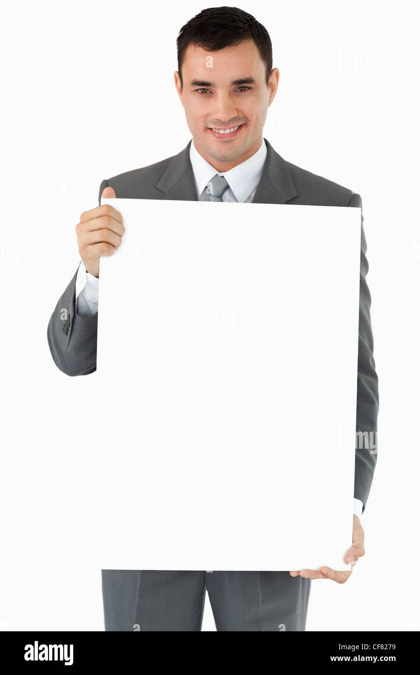 Businessman presenting sign Stock Photo - Alamy