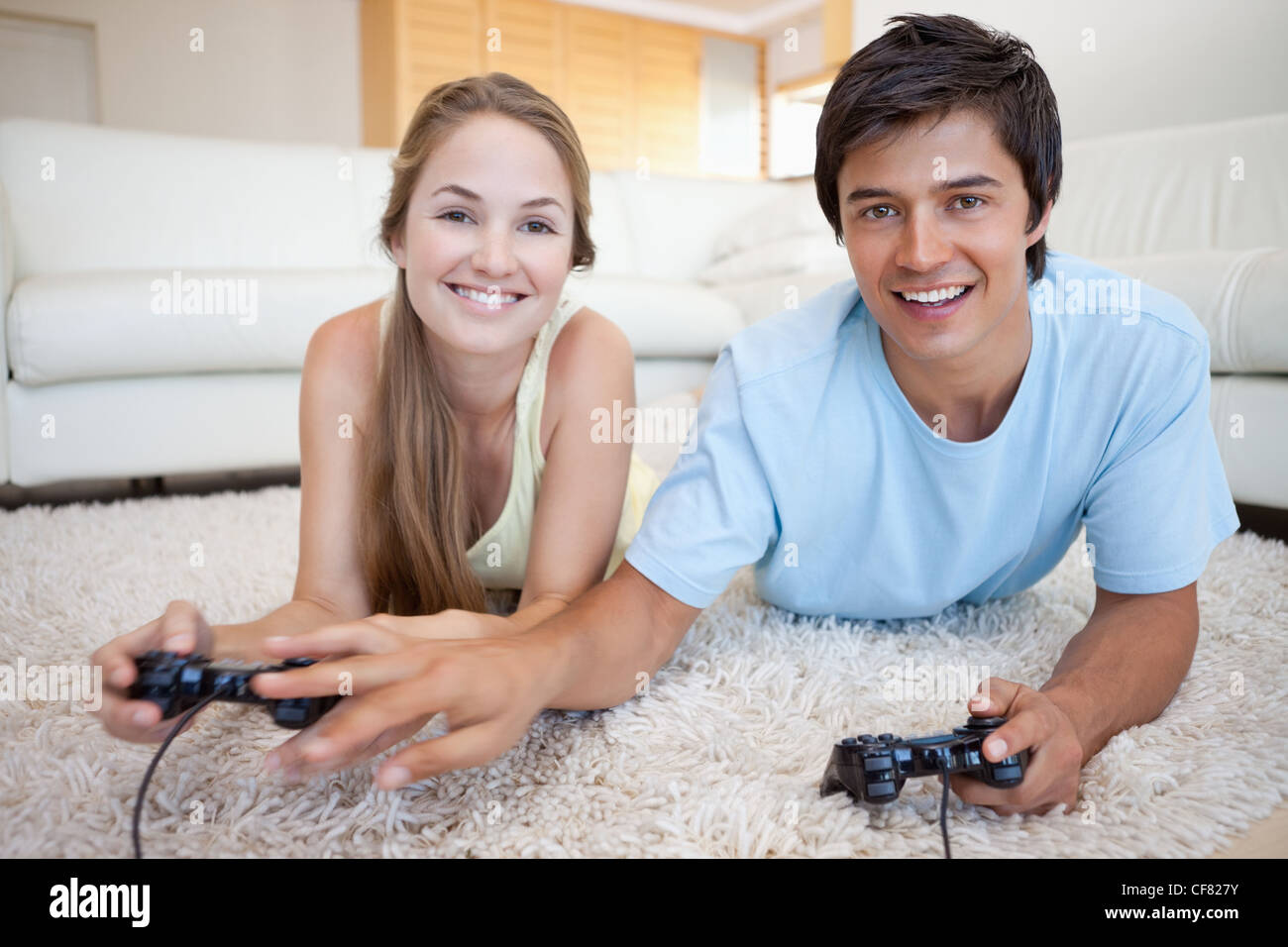 Young couple playing video games Stock Photo - Alamy