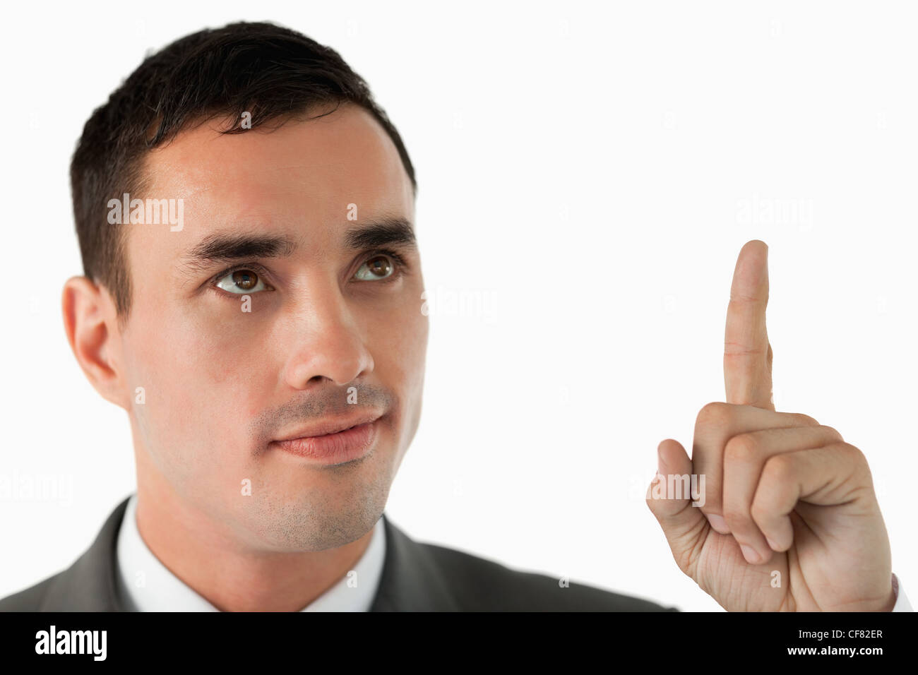 Close up of businessman pointing upwards Stock Photo - Alamy