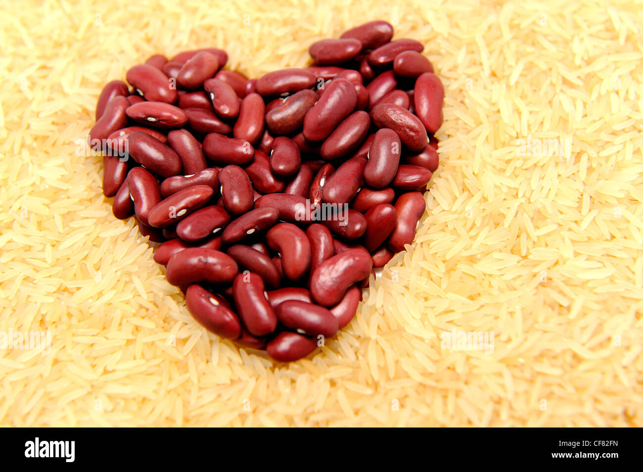 A heart shape made from dried kidney beans surrounded by basmati rice ...