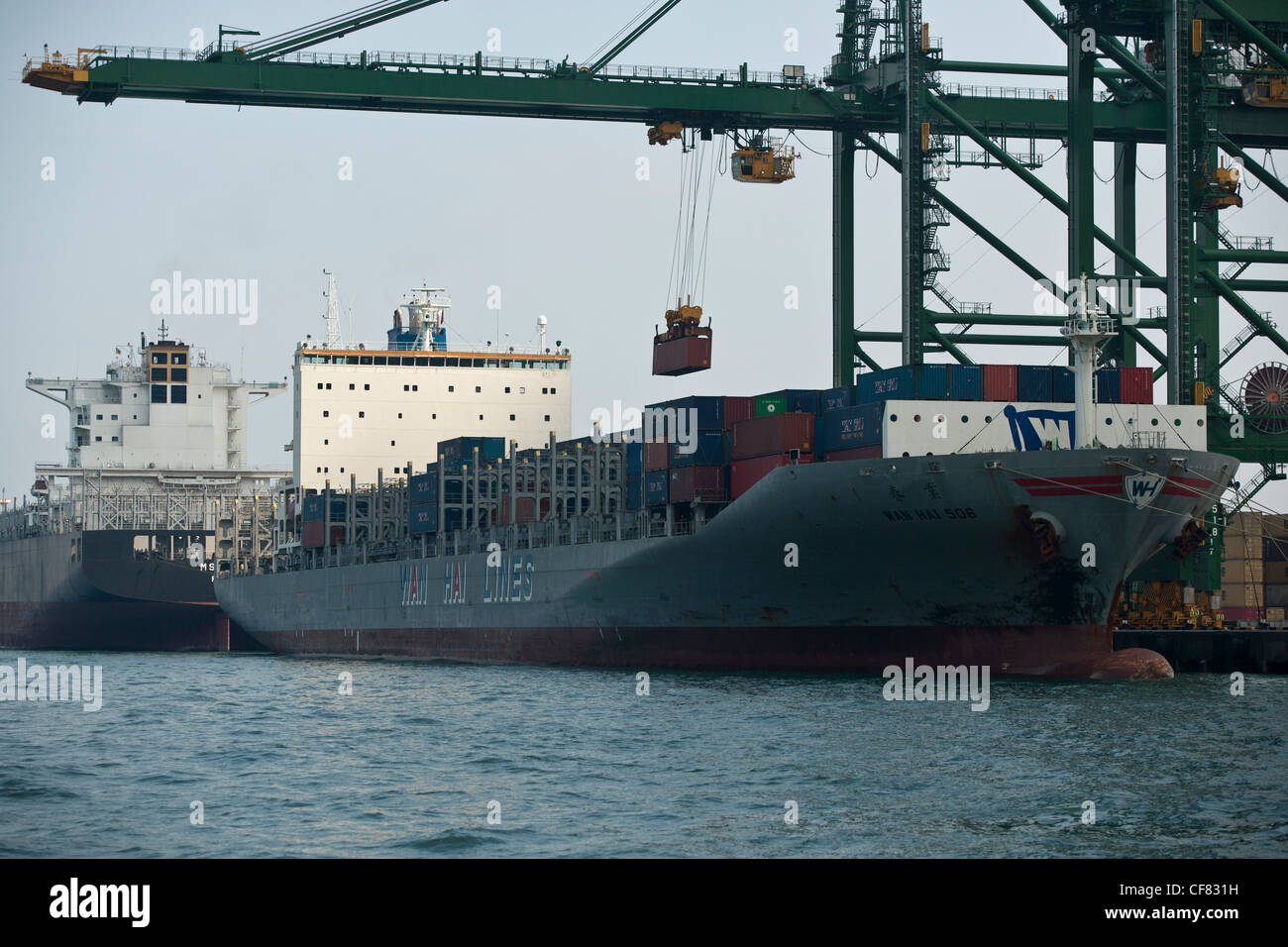 Container ships are seen moored at the Pasir Panjang terminal of the ...
