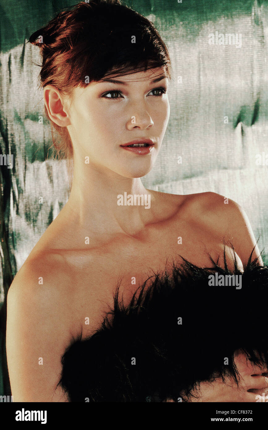 Red head female with her hair pulled back and fringe wearing a ...