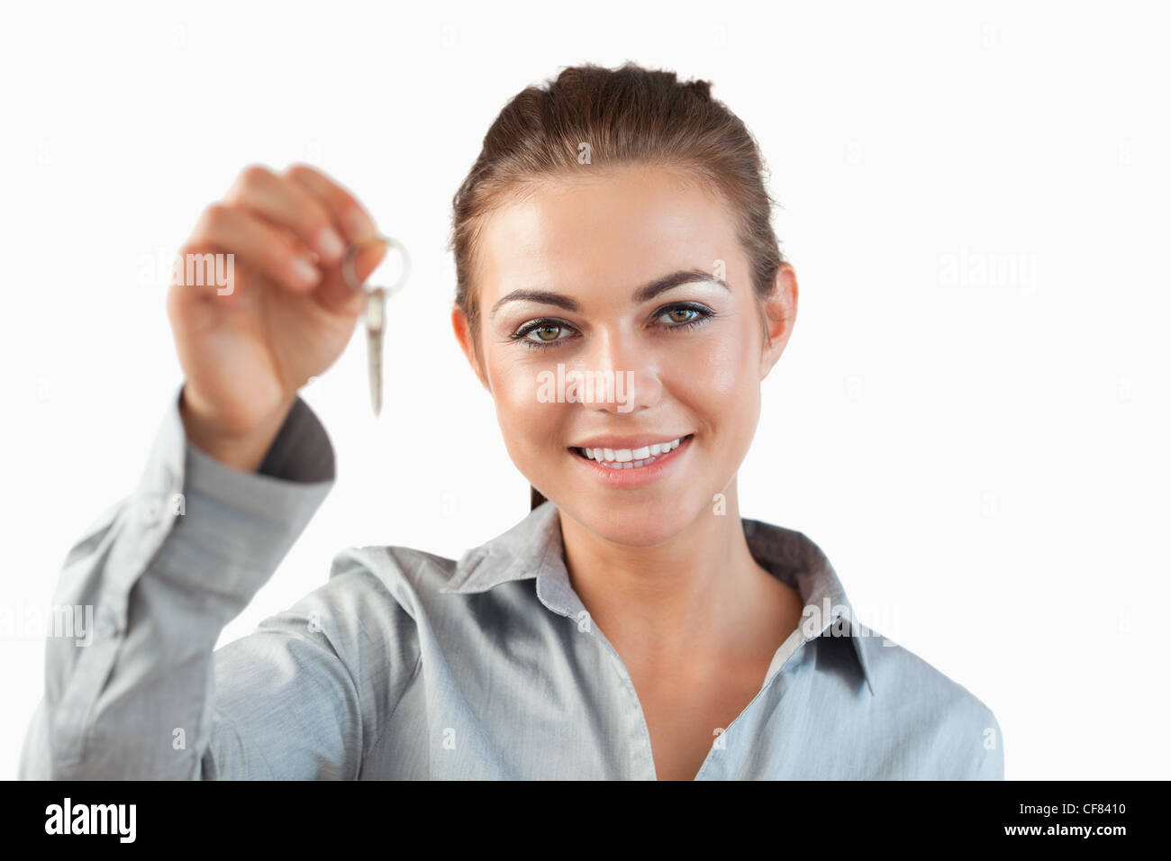 Woman holding metal keys hi-res stock photography and images - Alamy