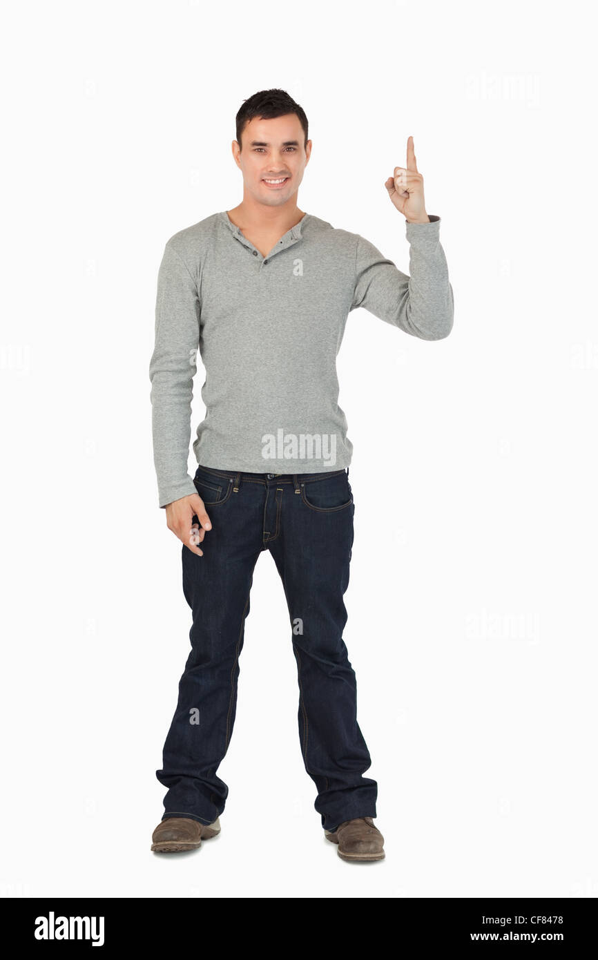 Young male pointing upwards Stock Photo - Alamy