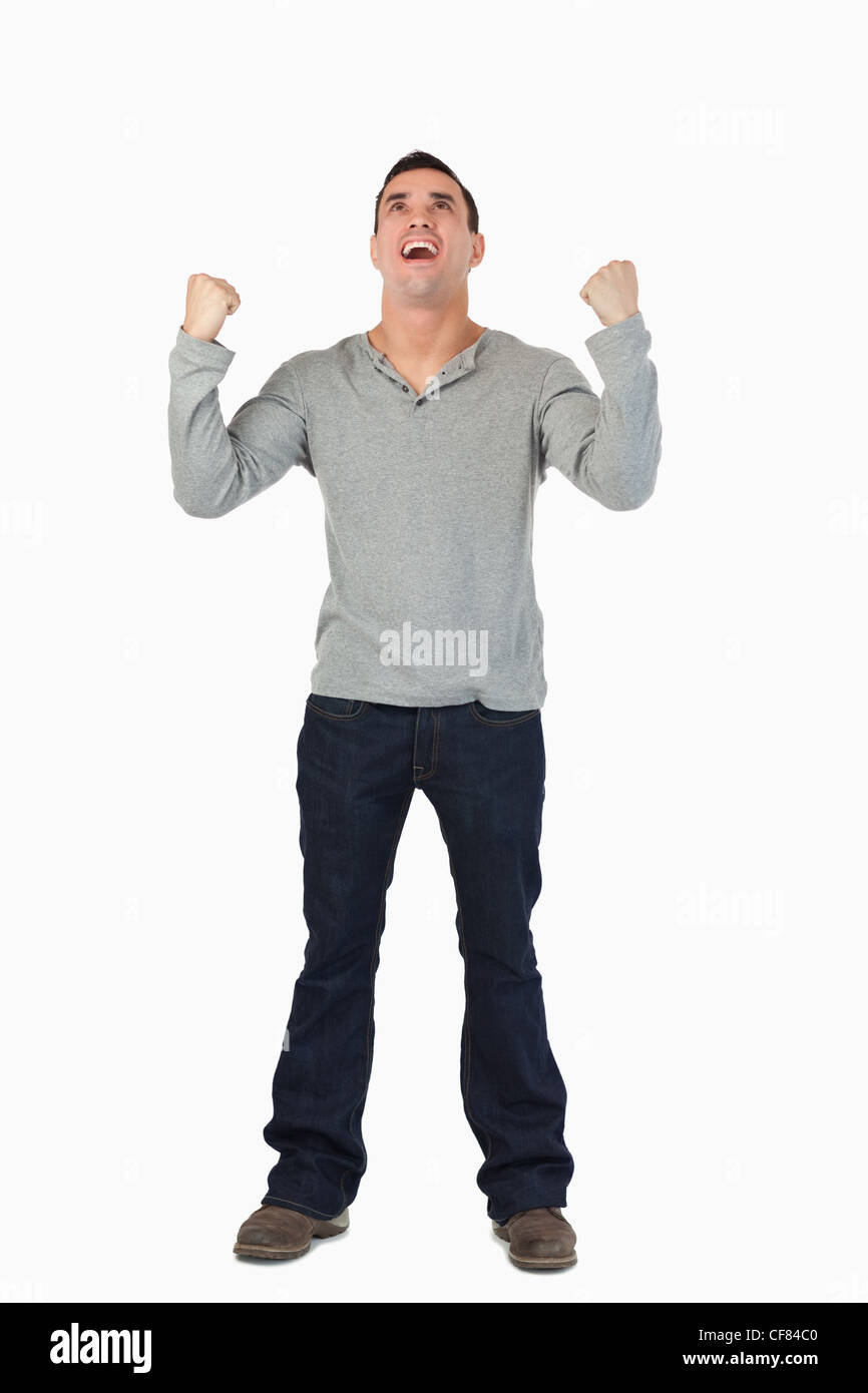Young male celebrating a victory Stock Photo - Alamy