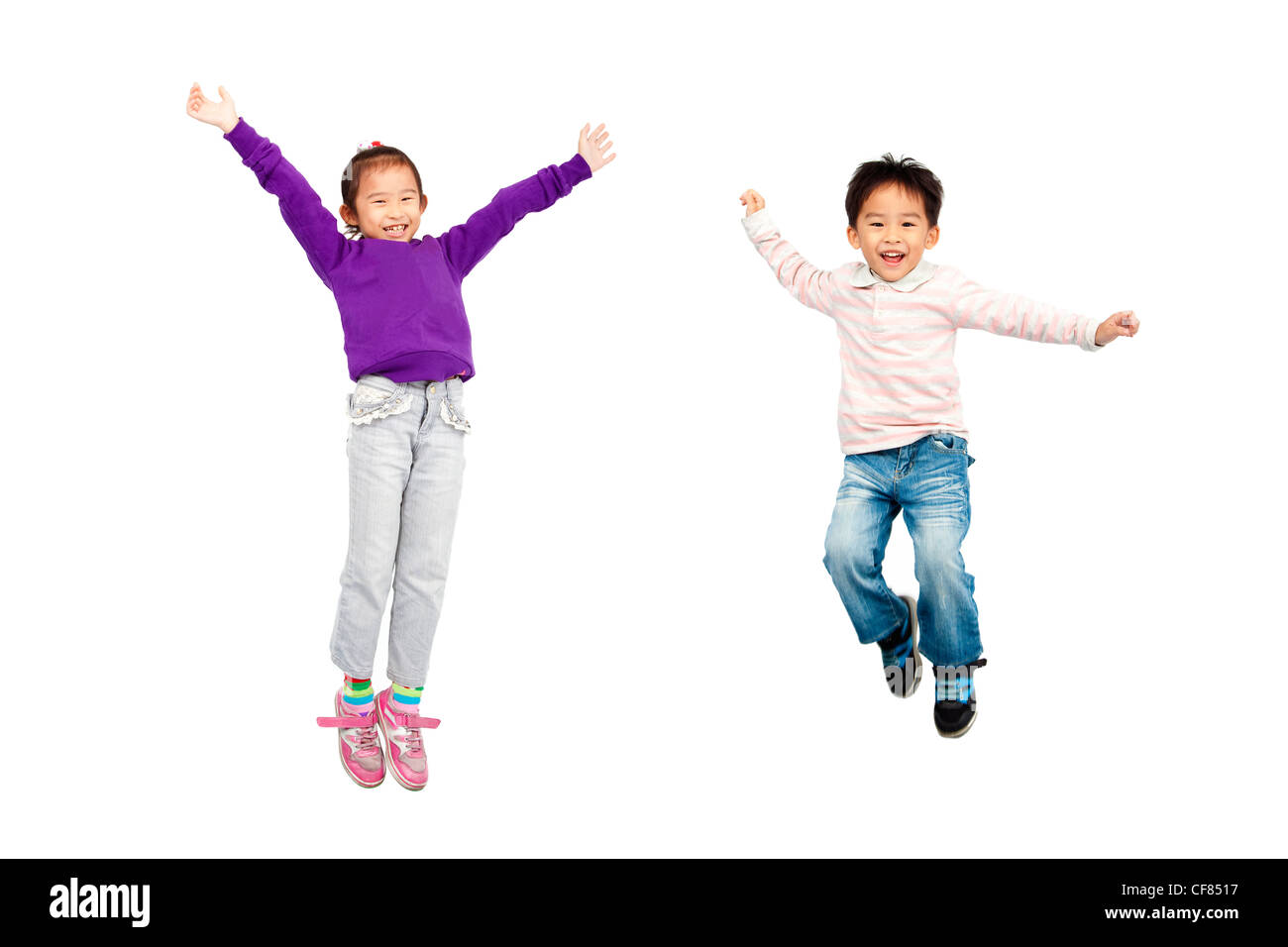 happy boy and girl jumping together Stock Photo - Alamy