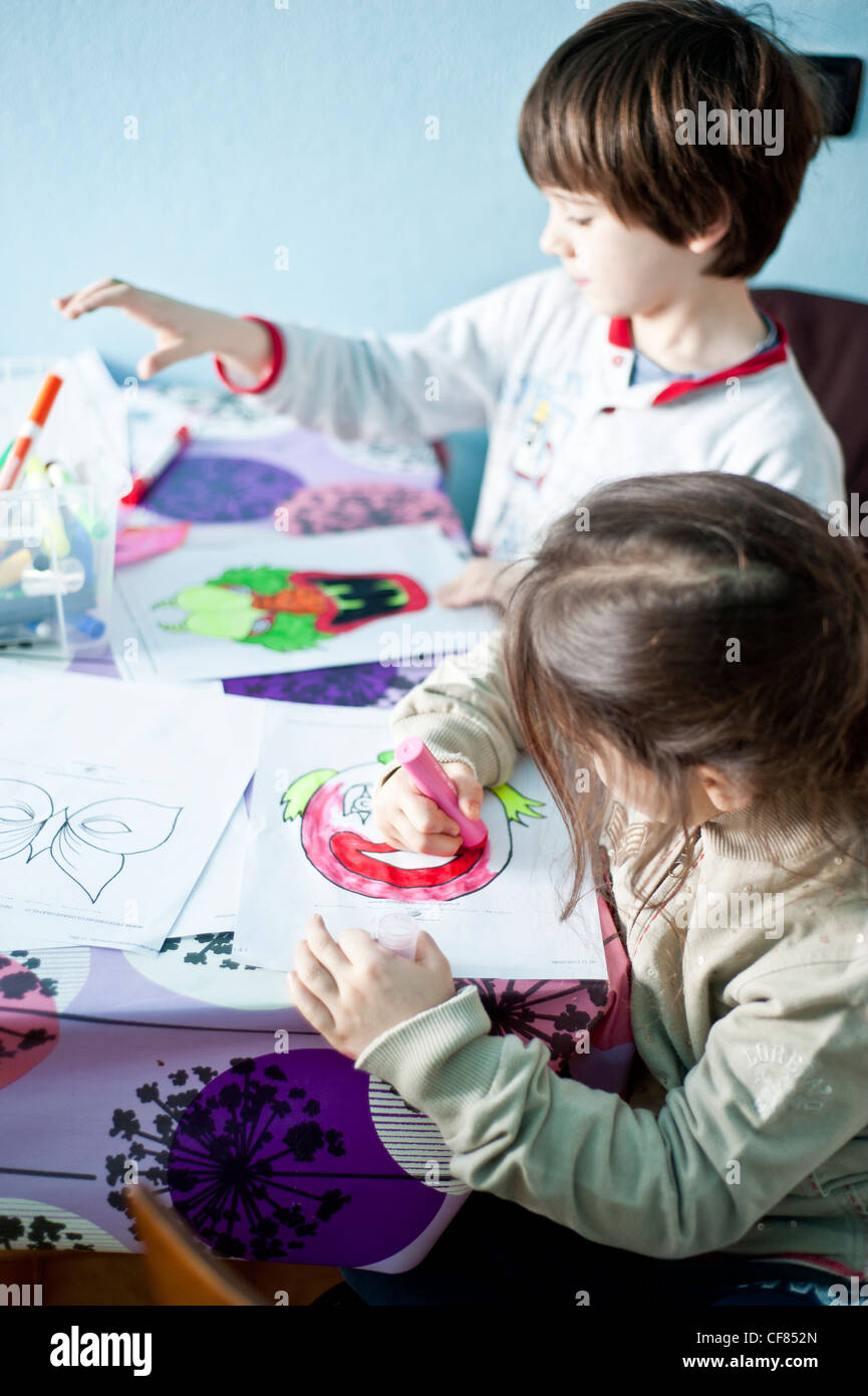 children draw at the table of kitchen Stock Photo - Alamy