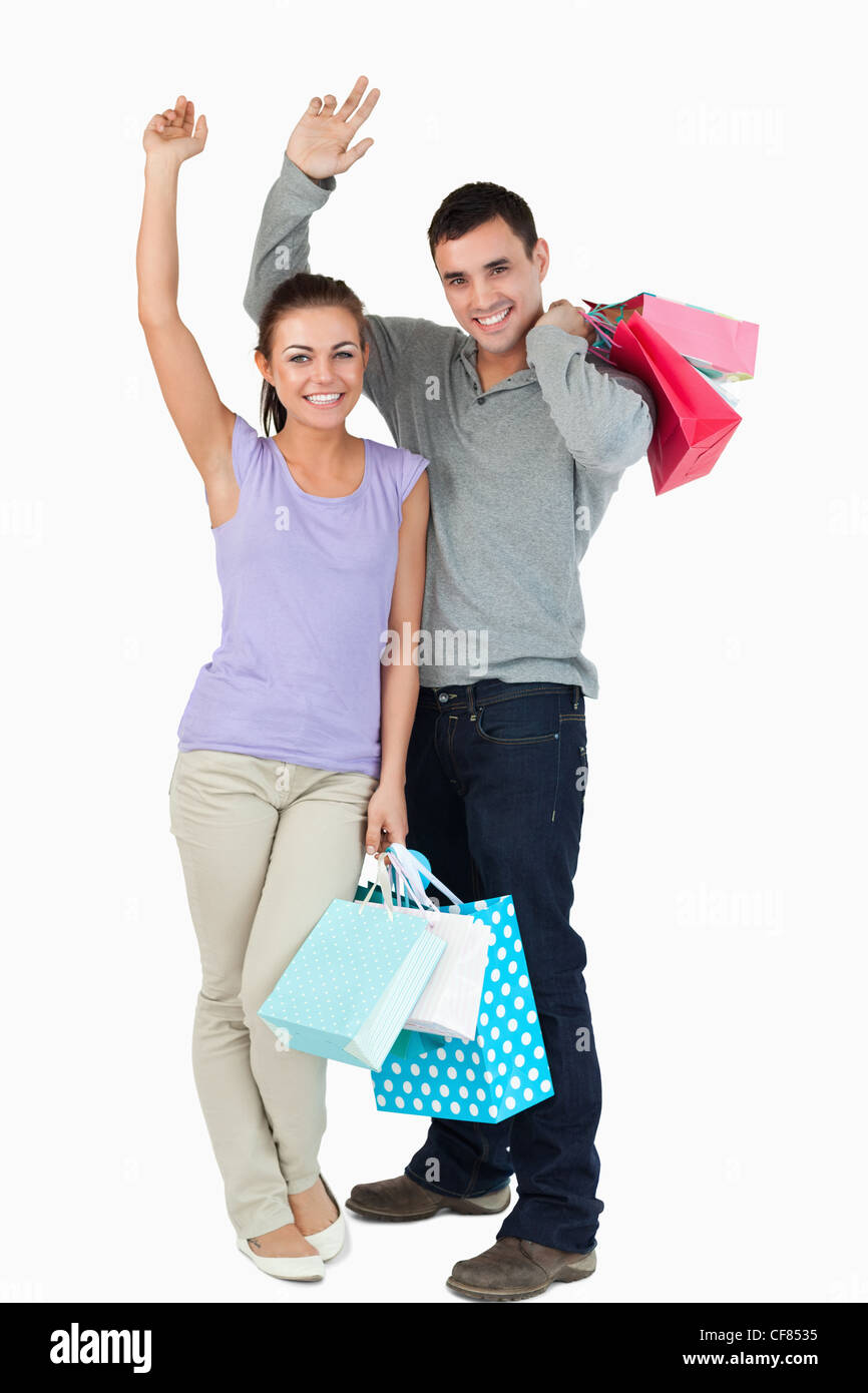 Happy young couple after shopping Stock Photo - Alamy