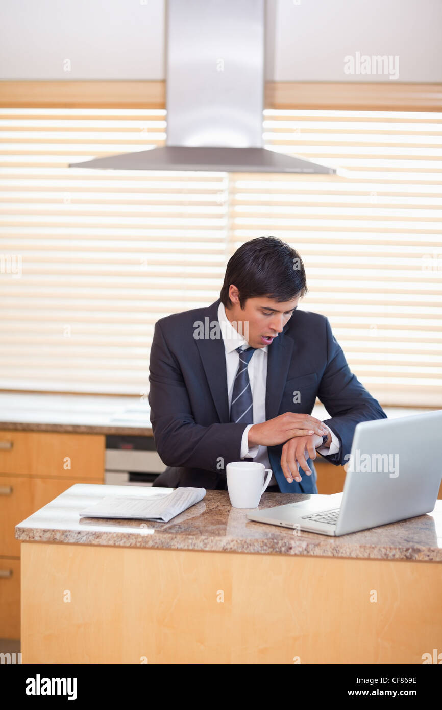 Portrait of a businessman running late Stock Photo - Alamy