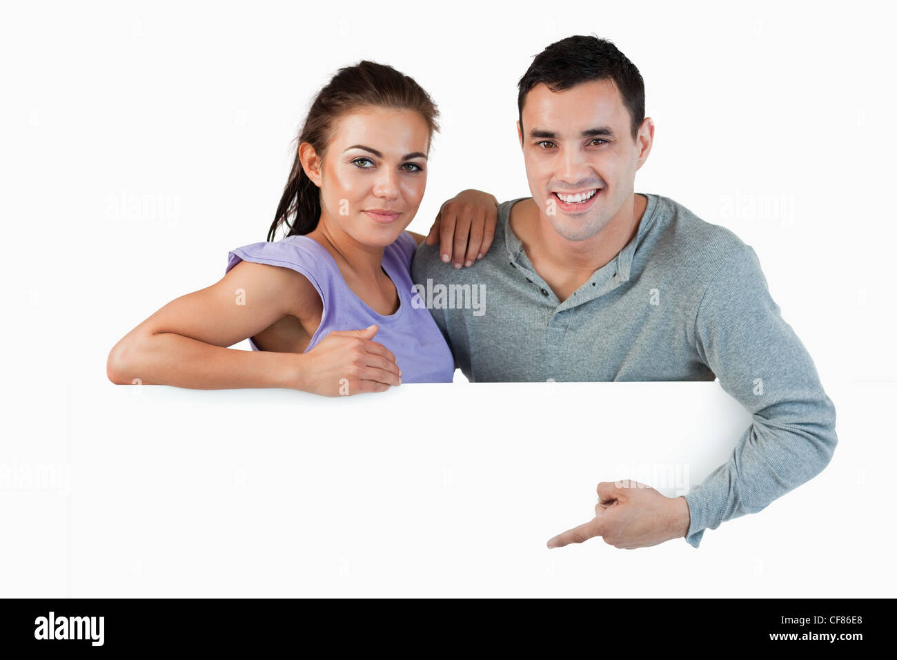 Young couple presenting advertisement Stock Photo - Alamy
