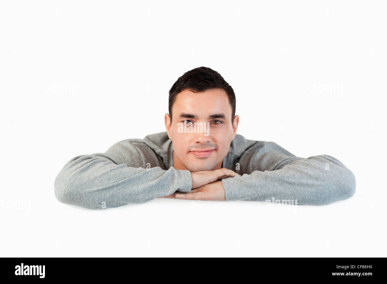Young male looking over a wall Stock Photo - Alamy